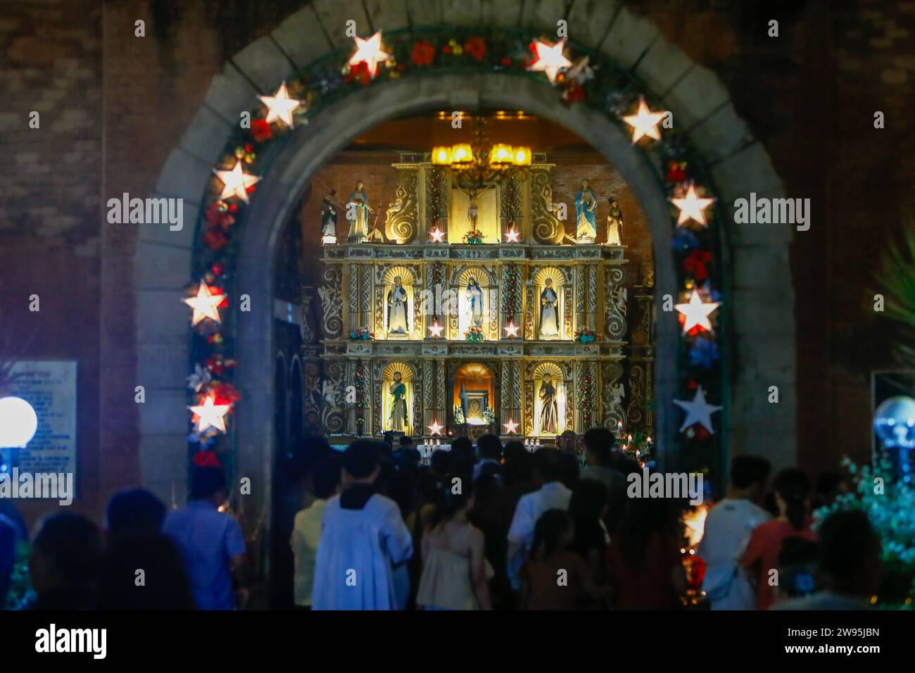 Boac, Marinduque, The Philippines. 25th Dec, 2023. People attend a ...