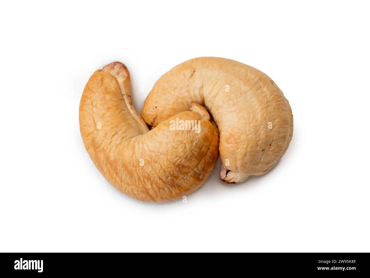 Top view of two Roasted brown cashew nuts in stack are isolated on ...