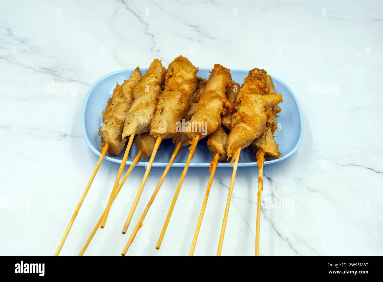 The delicious fried squid mixed with flour and seasonings on dish with ...