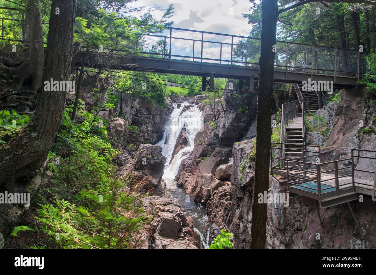 A waterfall and walkway within the high falls conservation area in ...
