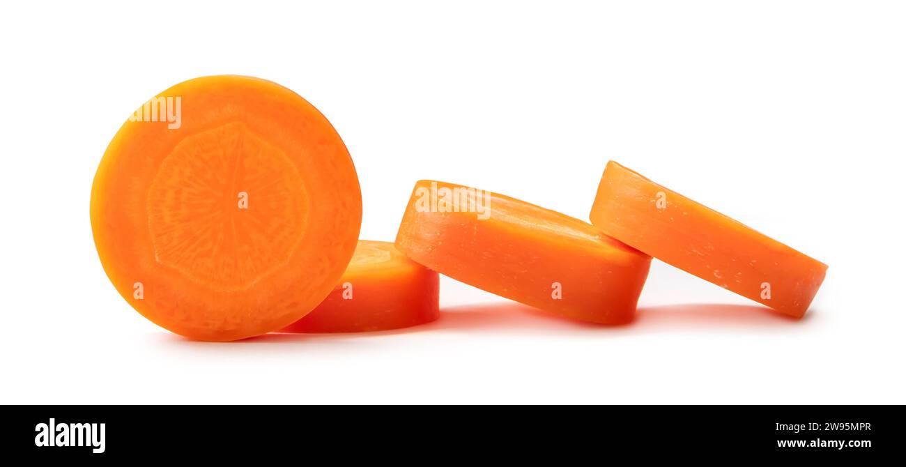 Fresh beautiful carrot slices in stack are isolated on white background ...