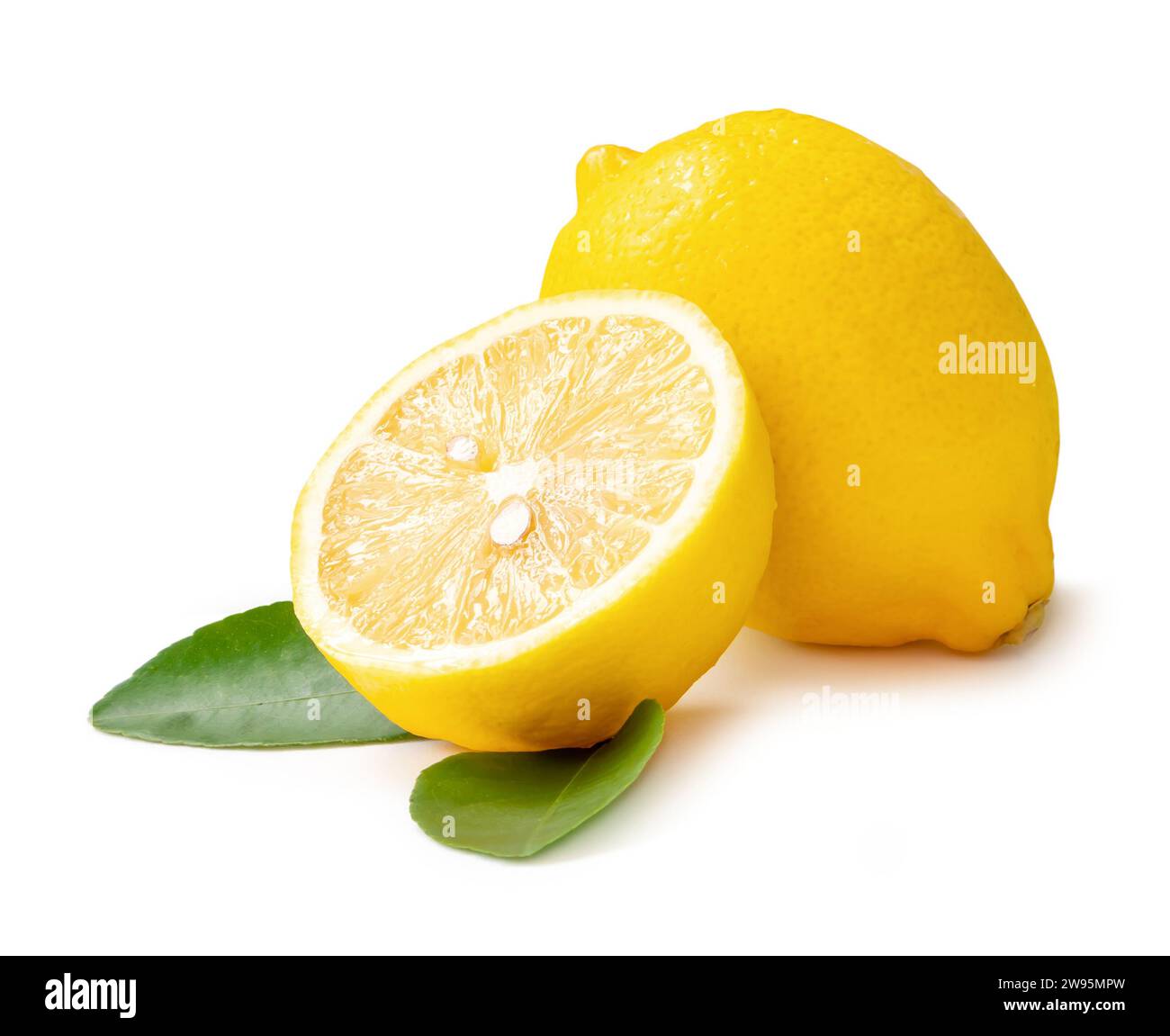 Single whole fresh beautiful yellow lemons with half and leaves is ...