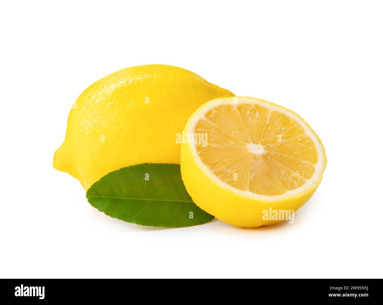 Single whole fresh beautiful yellow lemons with half and leaves is ...
