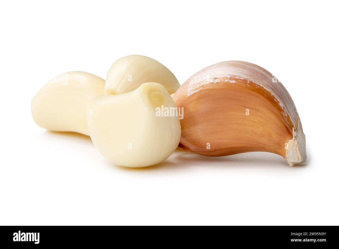 Front view of fresh garlic cloves in stack are isolated on white ...