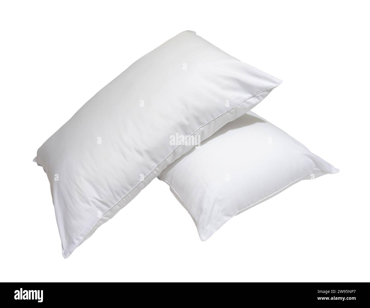 White pillows in stack in hotel or resort room are isolated on white ...