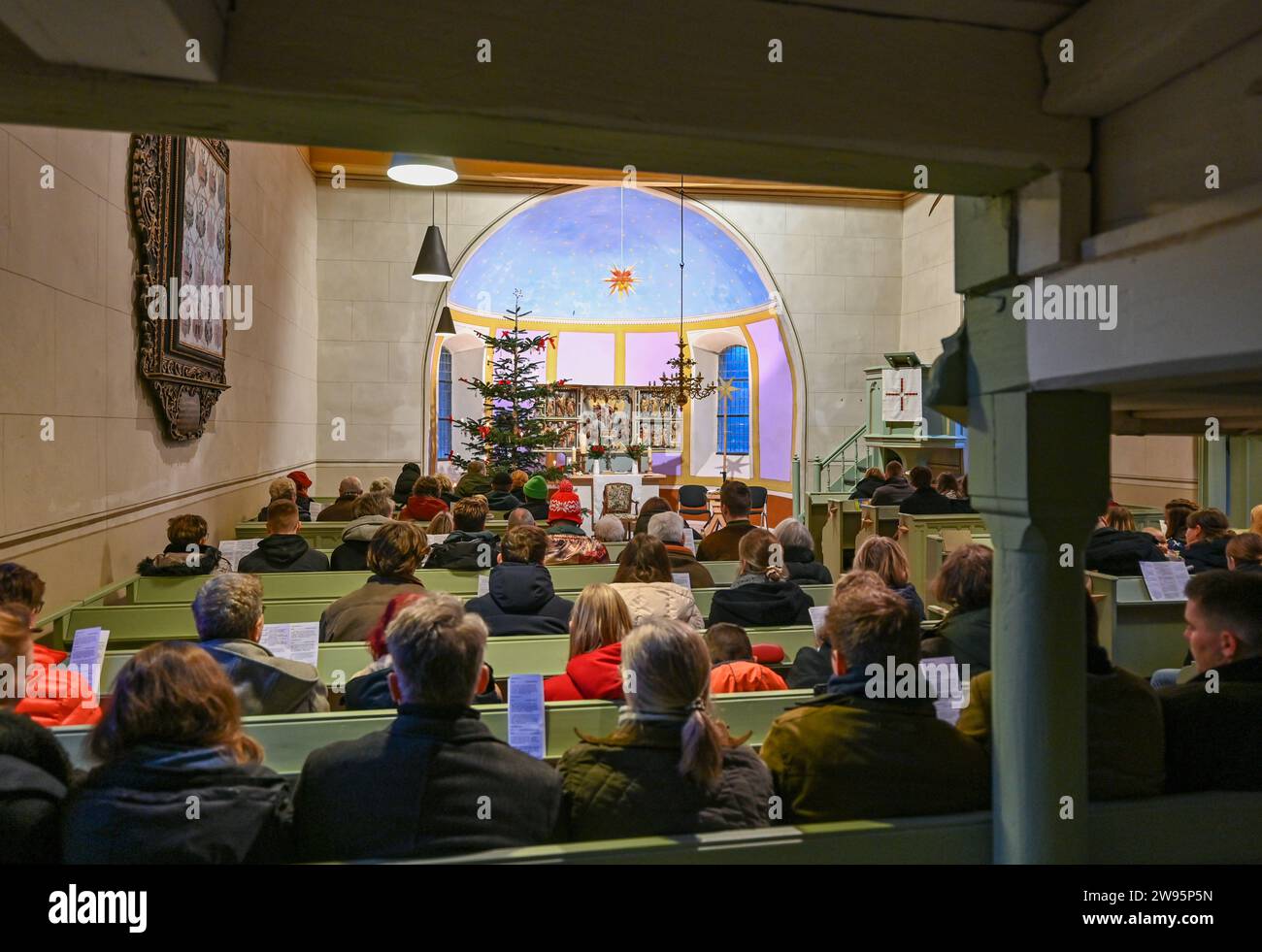 Sieversdorf, Germany. 24th Dec, 2023. Christmas Vespers is held in the ...