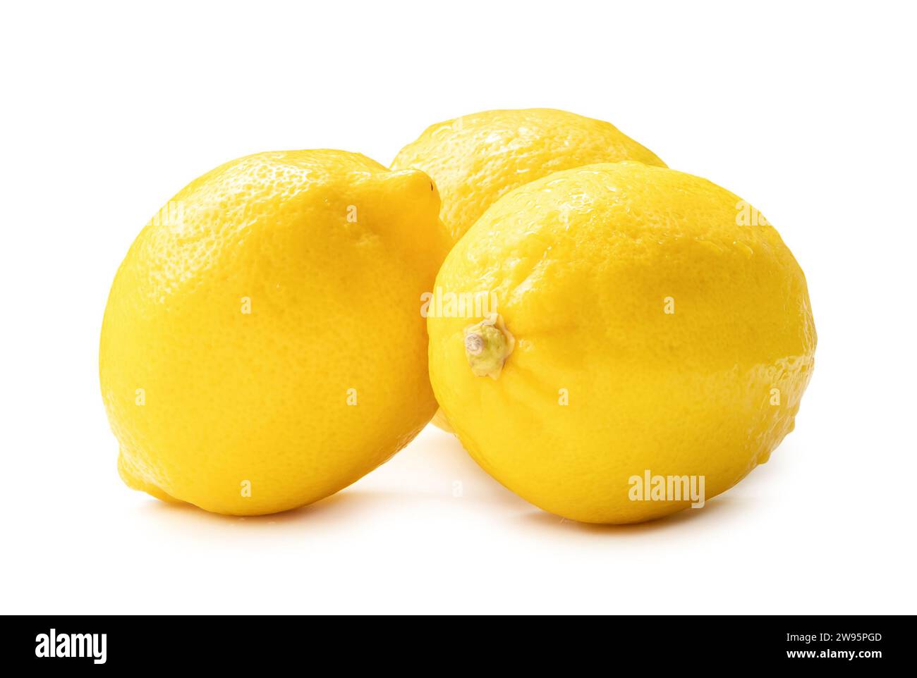 Three whole fresh beautiful yellow lemons in stack are isolated on ...