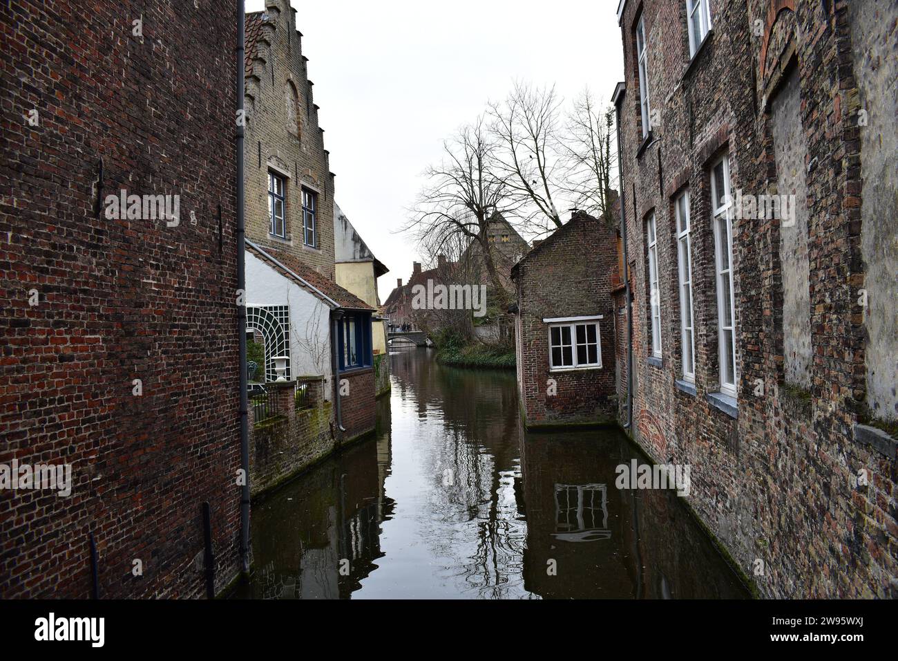 A view of a canal and the surrounding medieval houses in the city ...