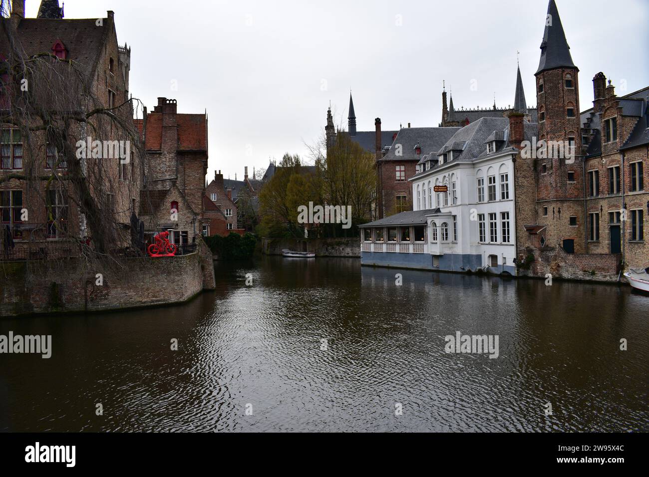 A view of a canal and the surrounding medieval houses in the city ...