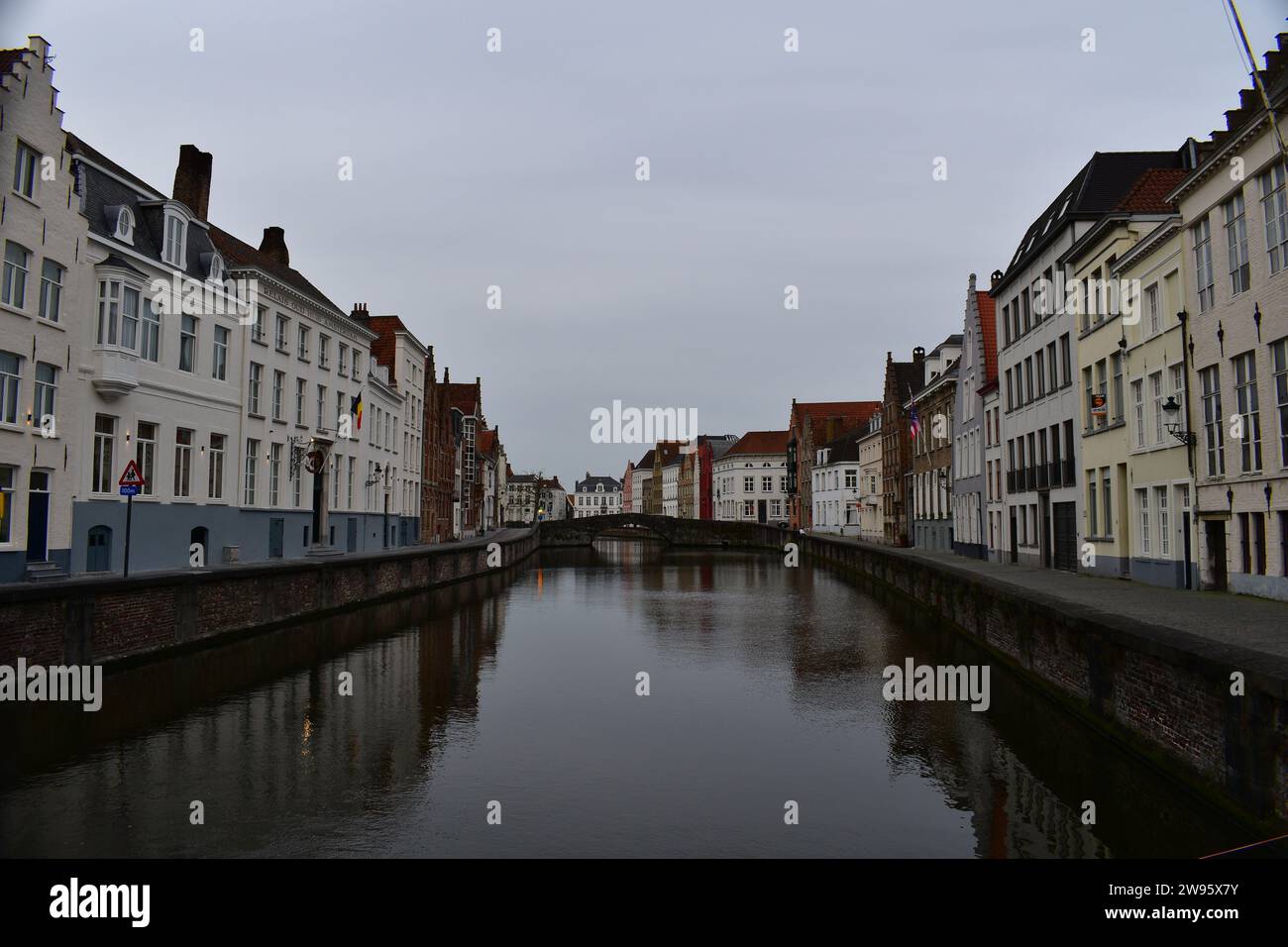 A view of a canal and the surrounding medieval houses in the city ...