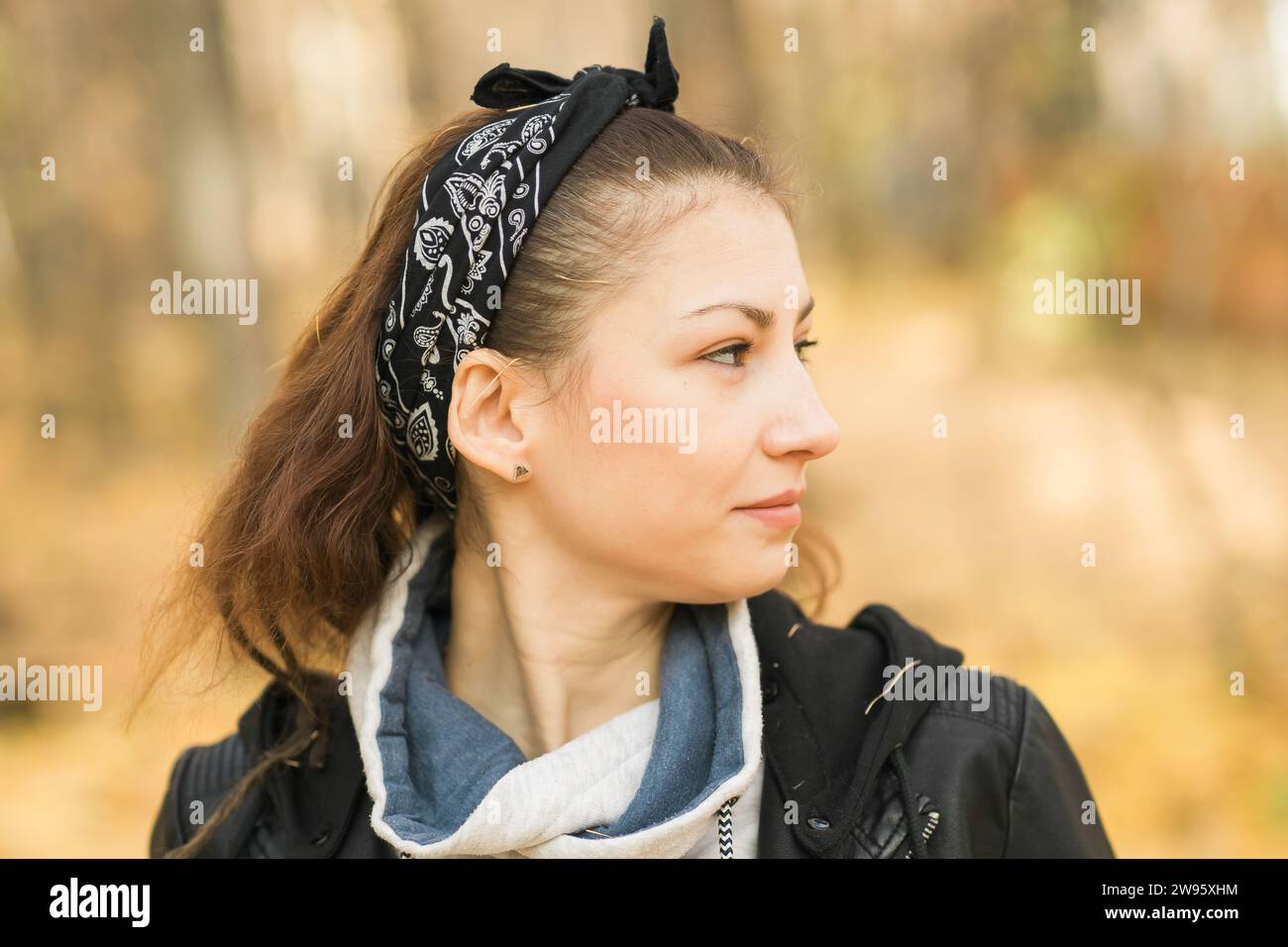 Autumn portrait of a beautiful happy woman in fall season copy space ...