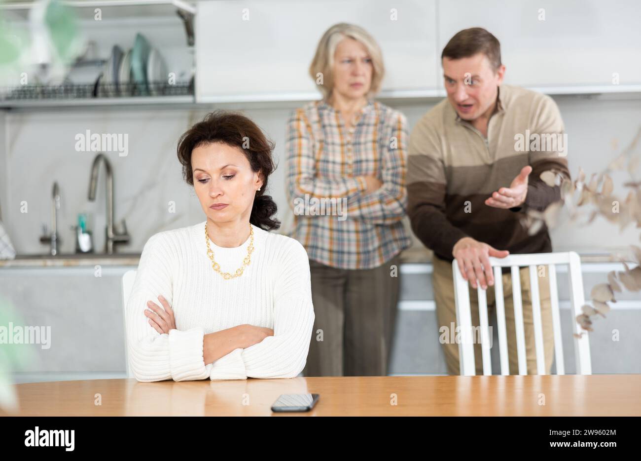 Family quarrel of three people Stock Photo - Alamy