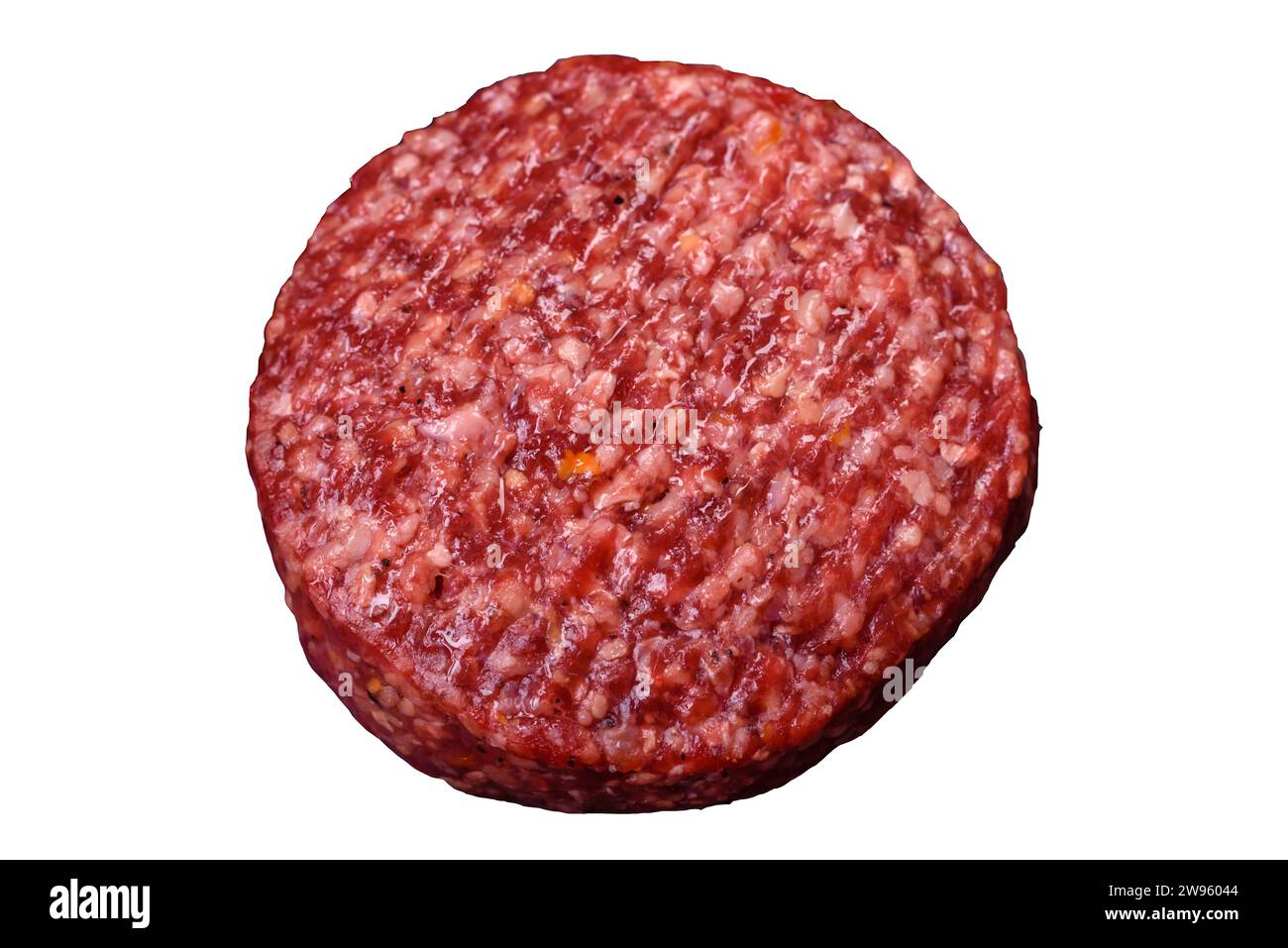 Fresh raw ground beef burger patty with salt and spices on textured ...