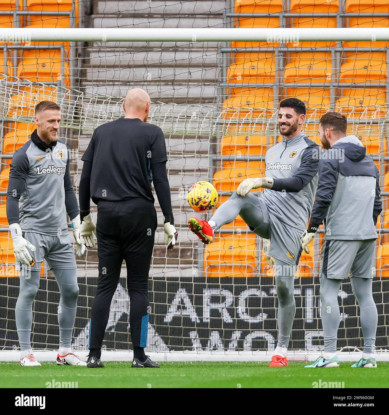 Wolverhampton, UK. 24th Dec, 2023. Wolves' goalkeepers warm up ahead of ...