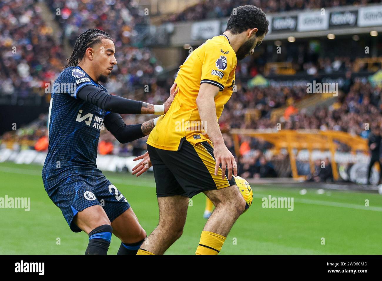 Wolverhampton, UK. 24th Dec, 2023. Chelsea's Malo Gusto & Wolves' Rayan ...