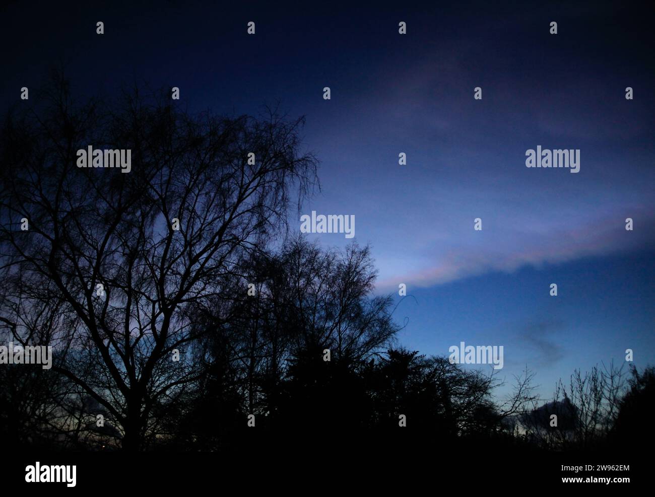 Winter sunset with rare high nacreous iridescent clouds optical effect ...