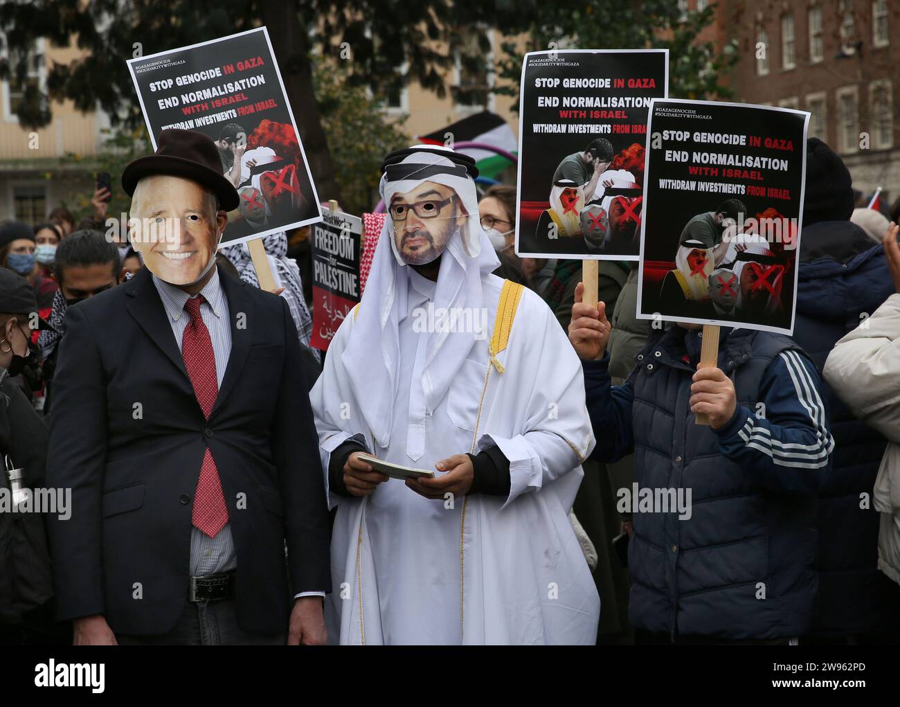 Protesters gather in Soho Square wearing face masks of American ...