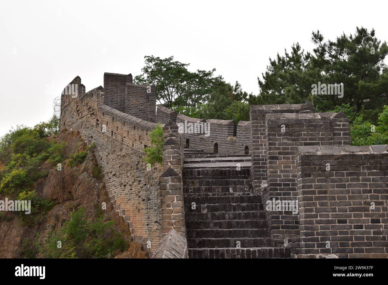 Stone staircase running along the topside of the Great Wall of China at ...