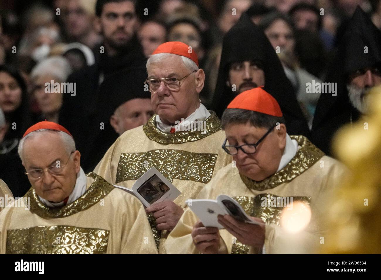 Cardinal Gerhard Ludwig Mueller, center, attends the Christmas eve Mass ...