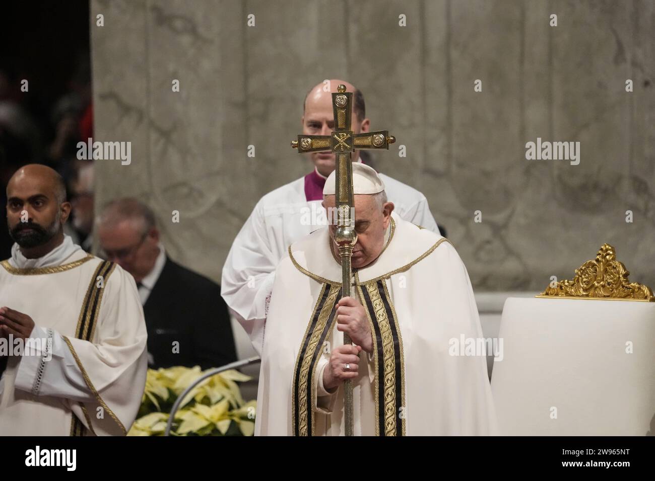 Pope Francis holds the pastoral staff as he presides over Christmas eve ...