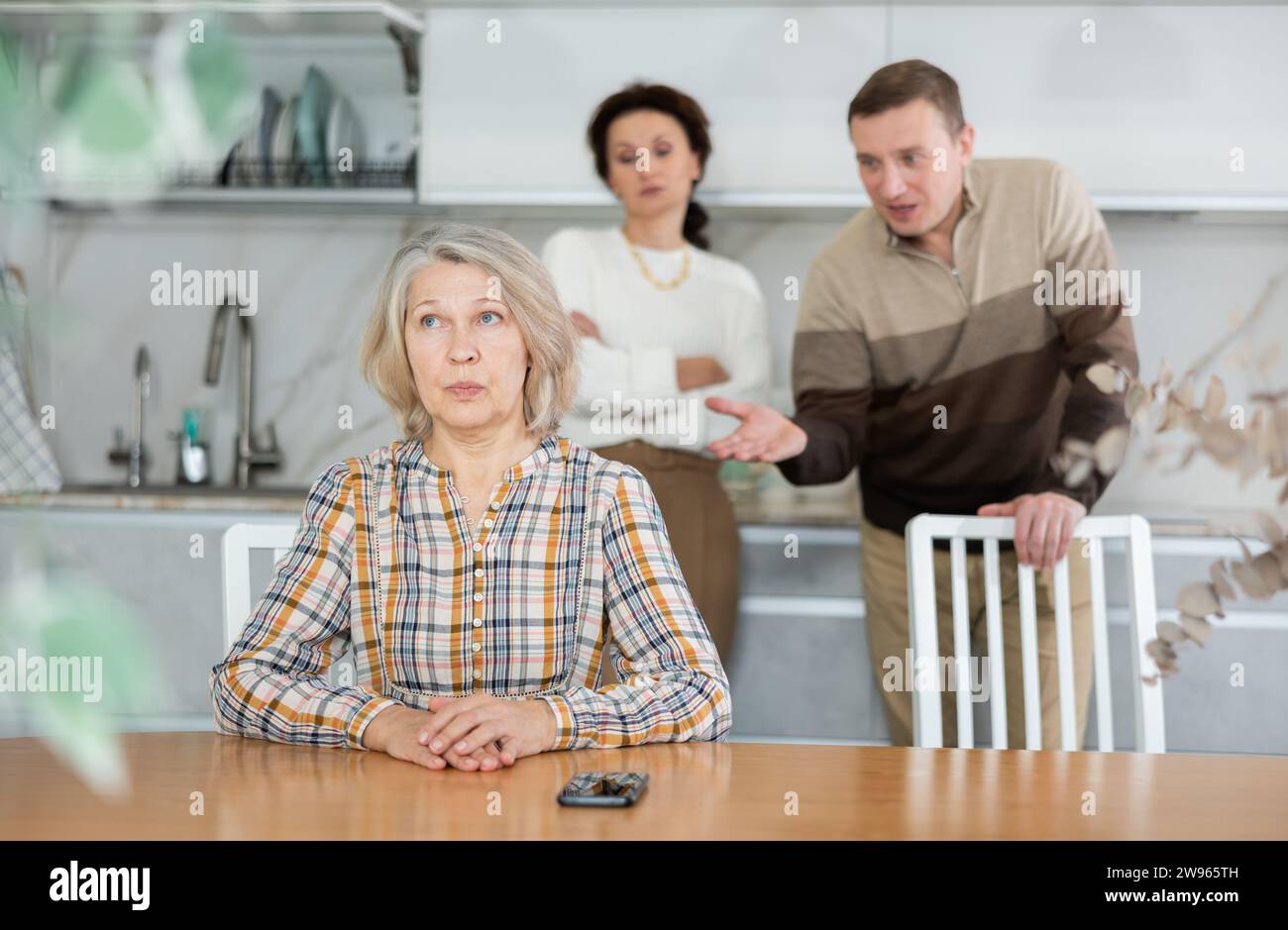 Family quarrel of three people Stock Photo - Alamy