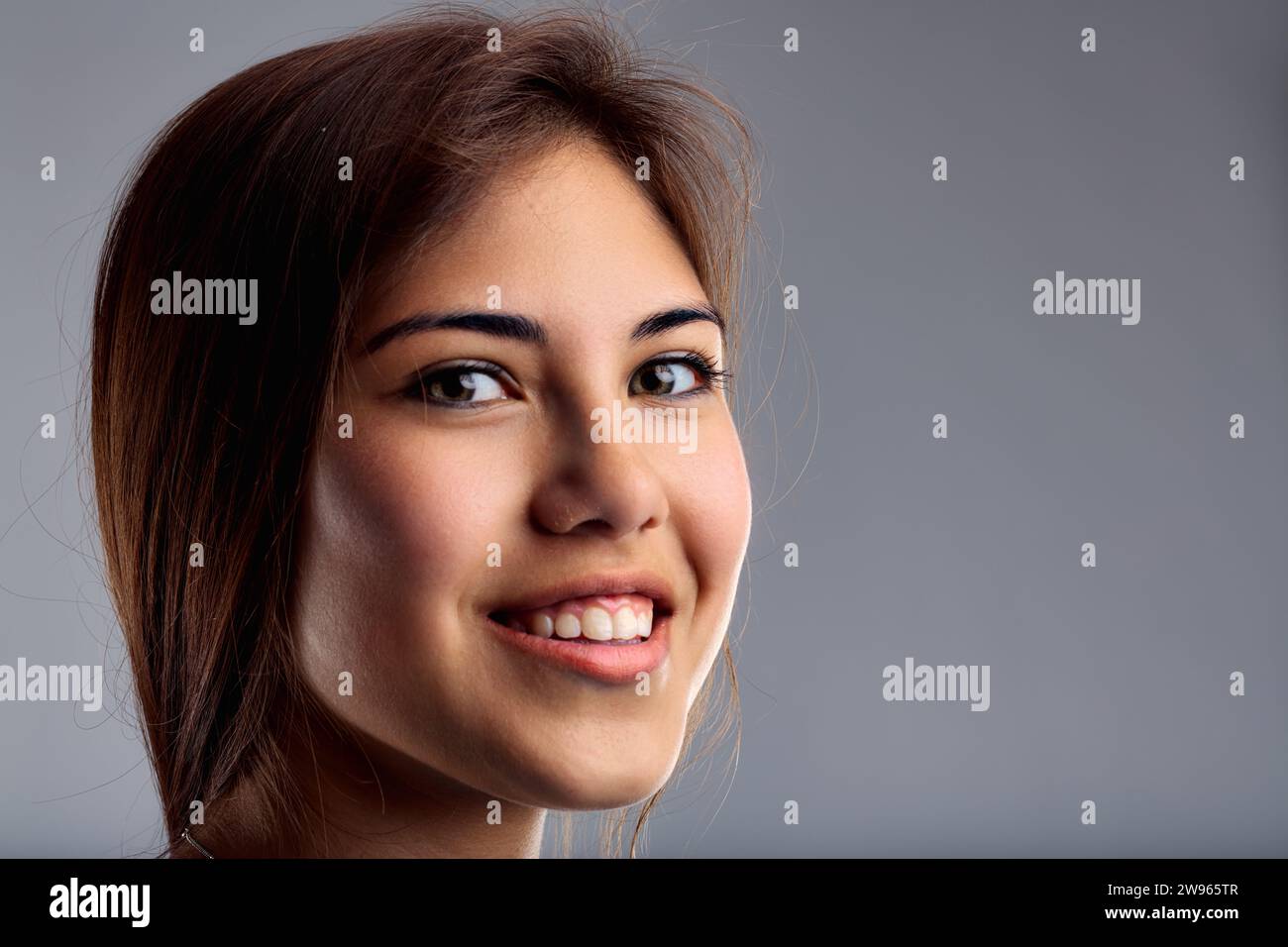 Casual yet composed, the young woman’s portrait exudes a sense of ...