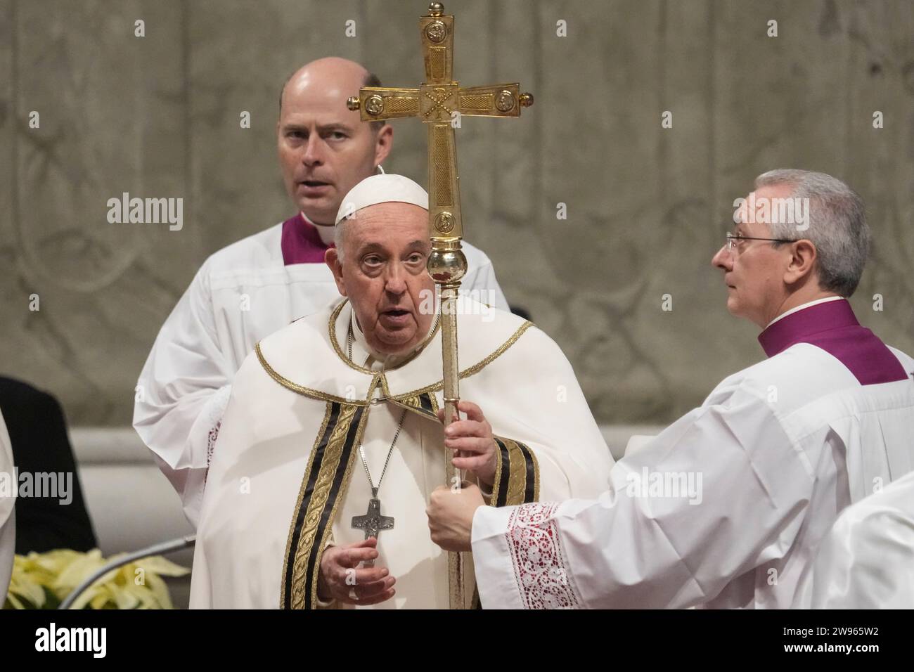 Pope Francis holds the pastoral staff as he presides over Christmas eve ...