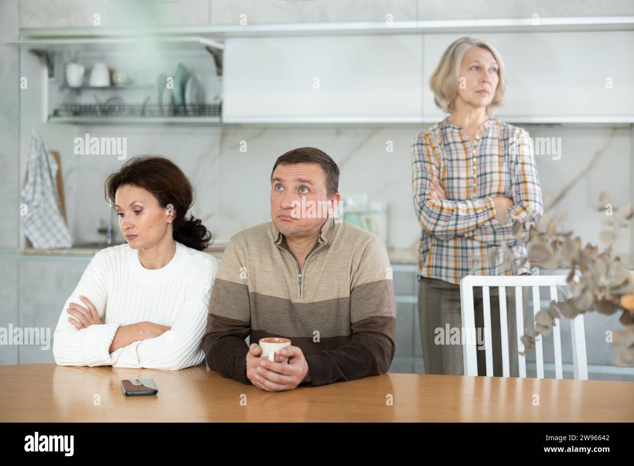 Family quarrel of three people Stock Photo - Alamy