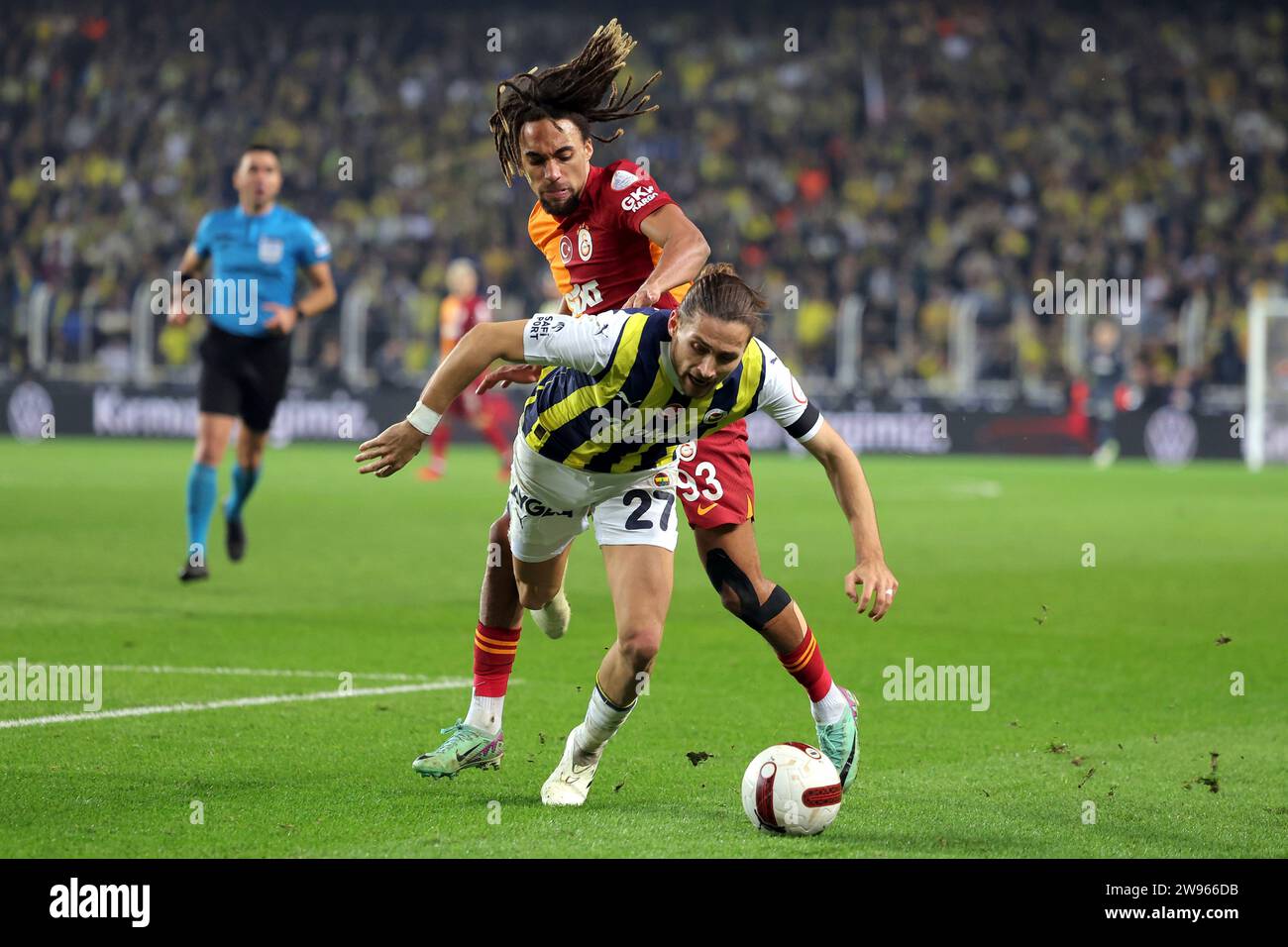 Fenerbahce's Miguel Crespo, front, and Galatasaray's Sacha Boey battle ...