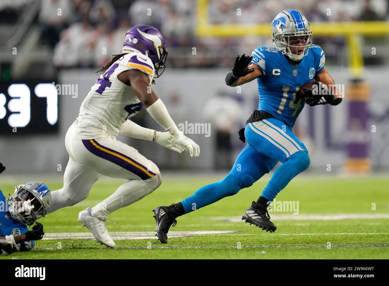 Detroit Lions wide receiver Amon-Ra St. Brown (14) runs from Minnesota ...
