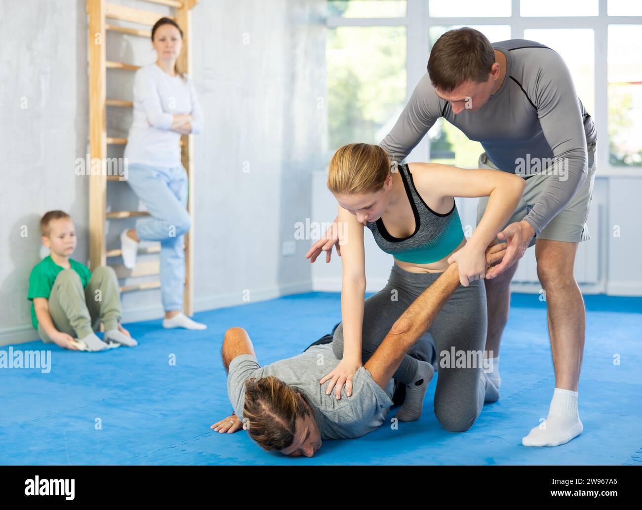 Focused girl in sport club during training, sparring and practicing ...