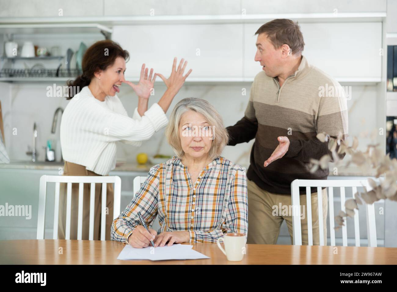 Old woman signing papers Stock Photo - Alamy