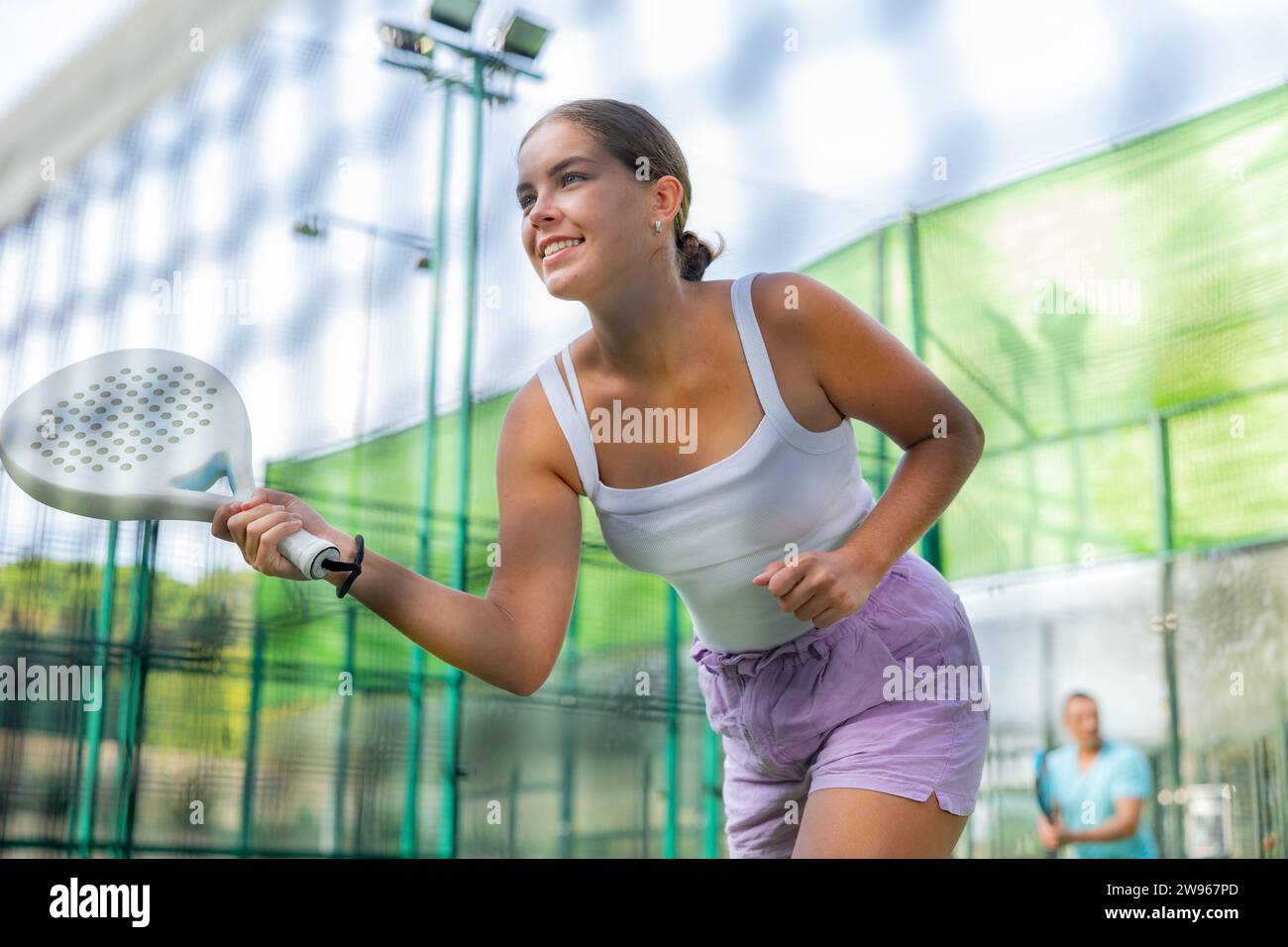 Woman padel tennis player training on court Stock Photo - Alamy