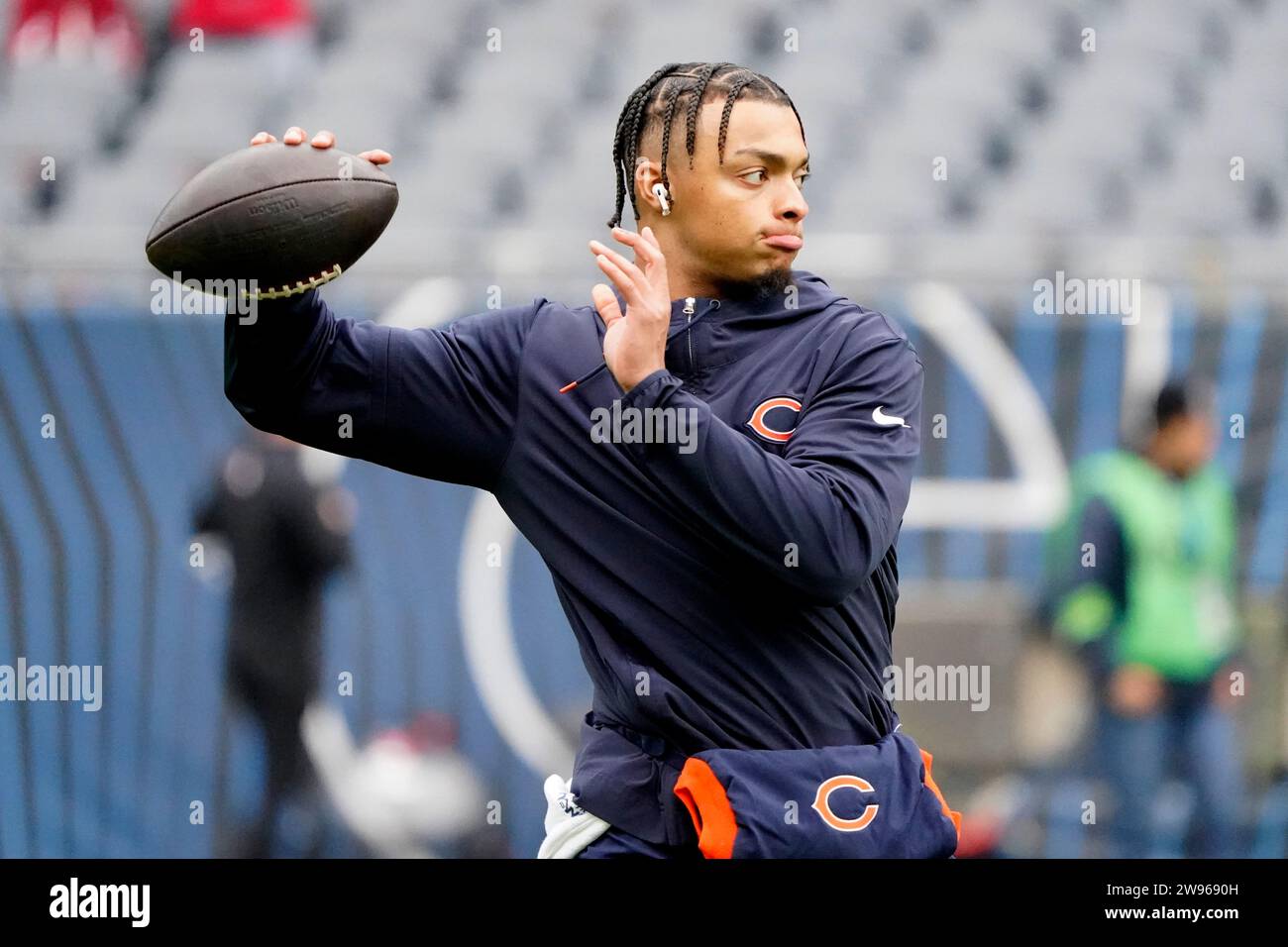 Chicago Bears quarterback Justin Fields warms up before an NFL football ...