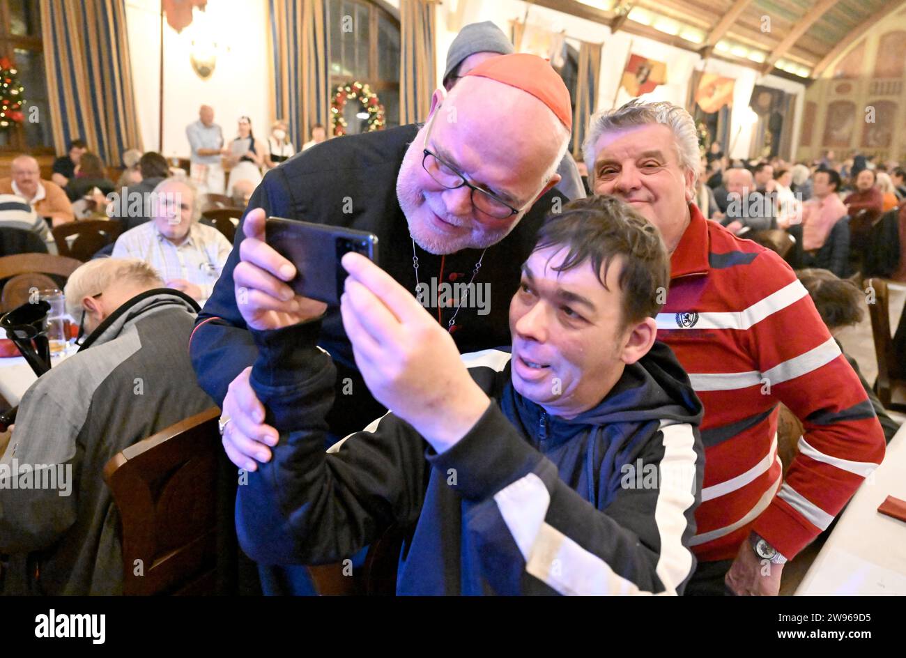 Munich, Germany. 24th Dec, 2023. Cardinal Reinhard Marx stands on stage ...