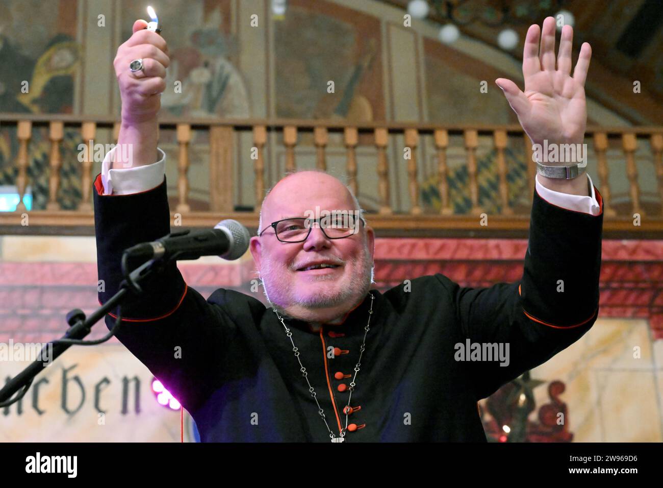 Munich, Germany. 24th Dec, 2023. Cardinal Reinhard Marx stands on stage ...