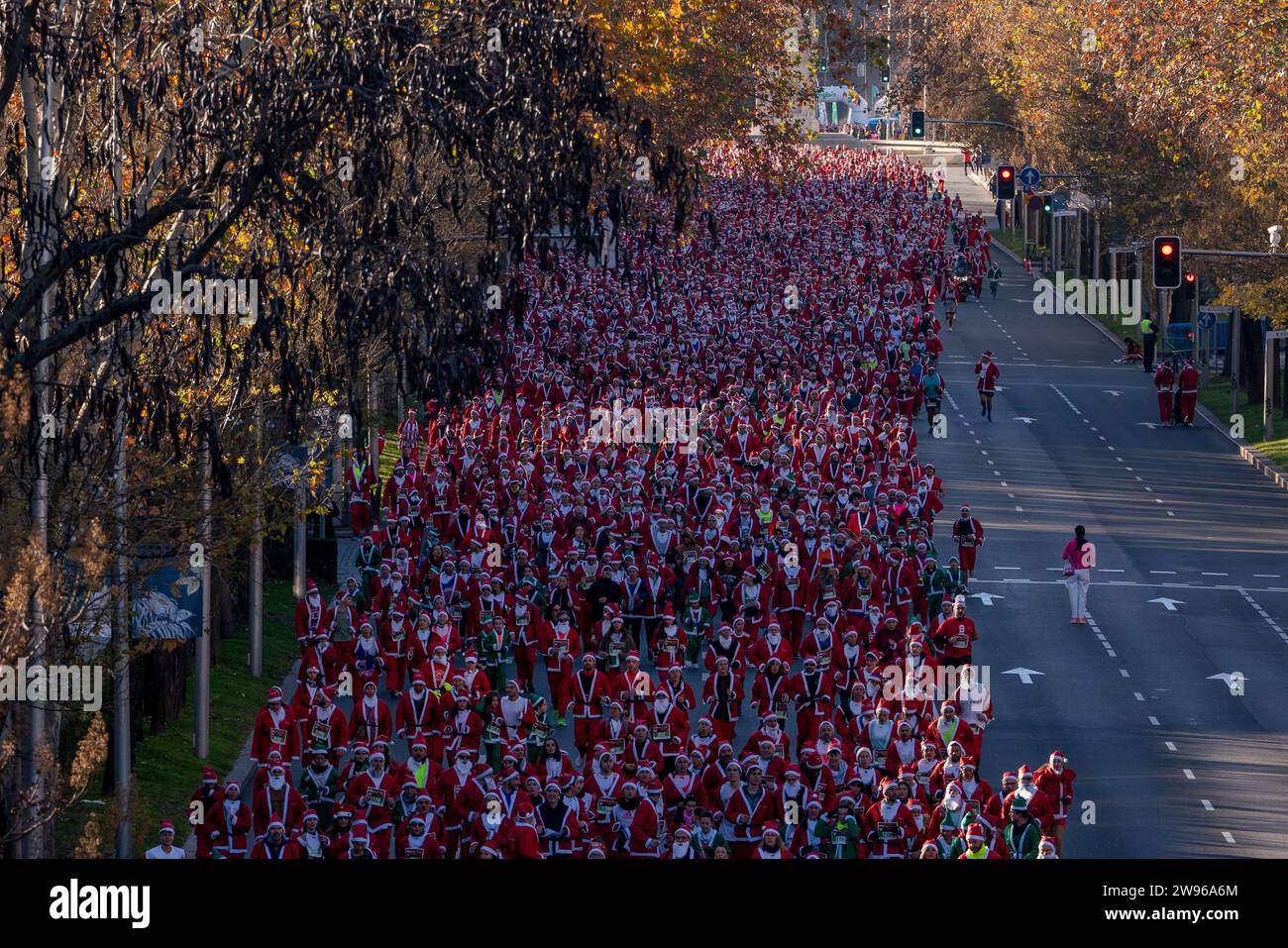 Thousands of people dressed as Santa Claus run during the traditional ...