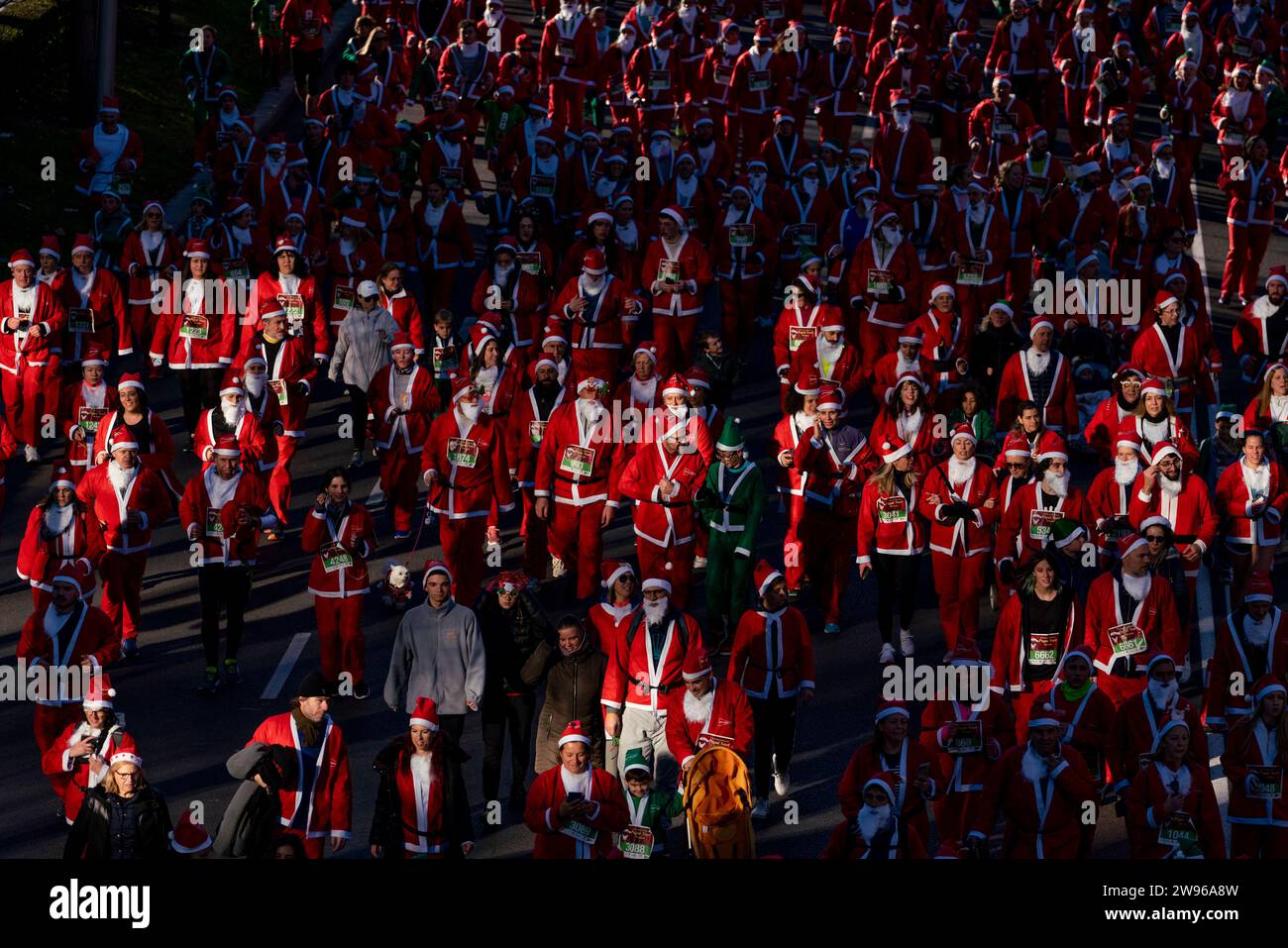 Thousands of people dressed as Santa Claus run during the traditional ...
