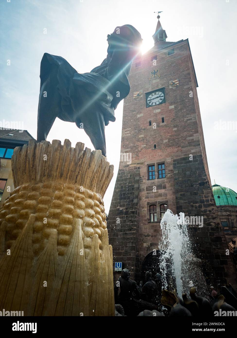 white tower of nuremberg with fountain sculpture Stock Photo - Alamy