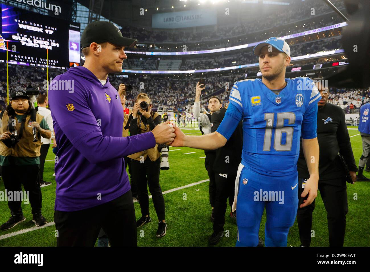 Detroit Lions quarterback Jared Goff (16) talks with Minnesota Vikings ...