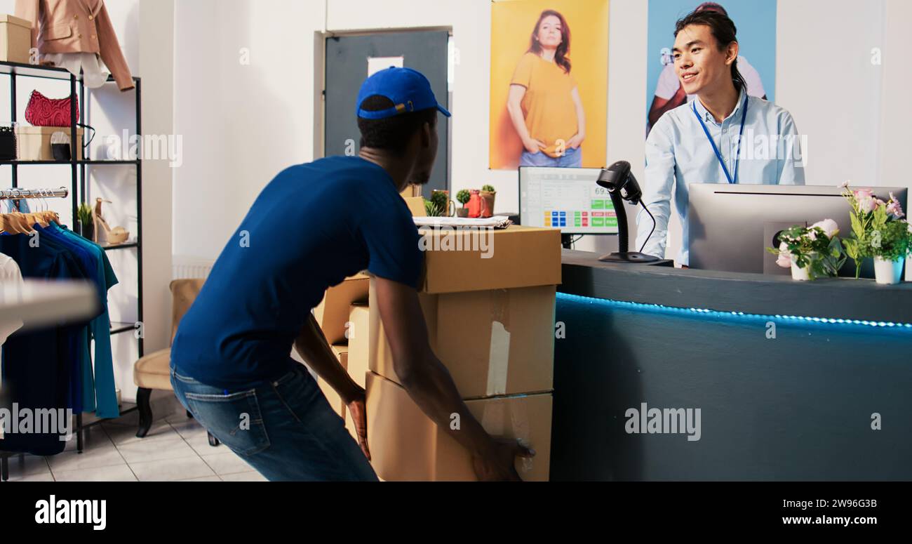 Deliveryman asking worker sign report hi-res stock photography and ...