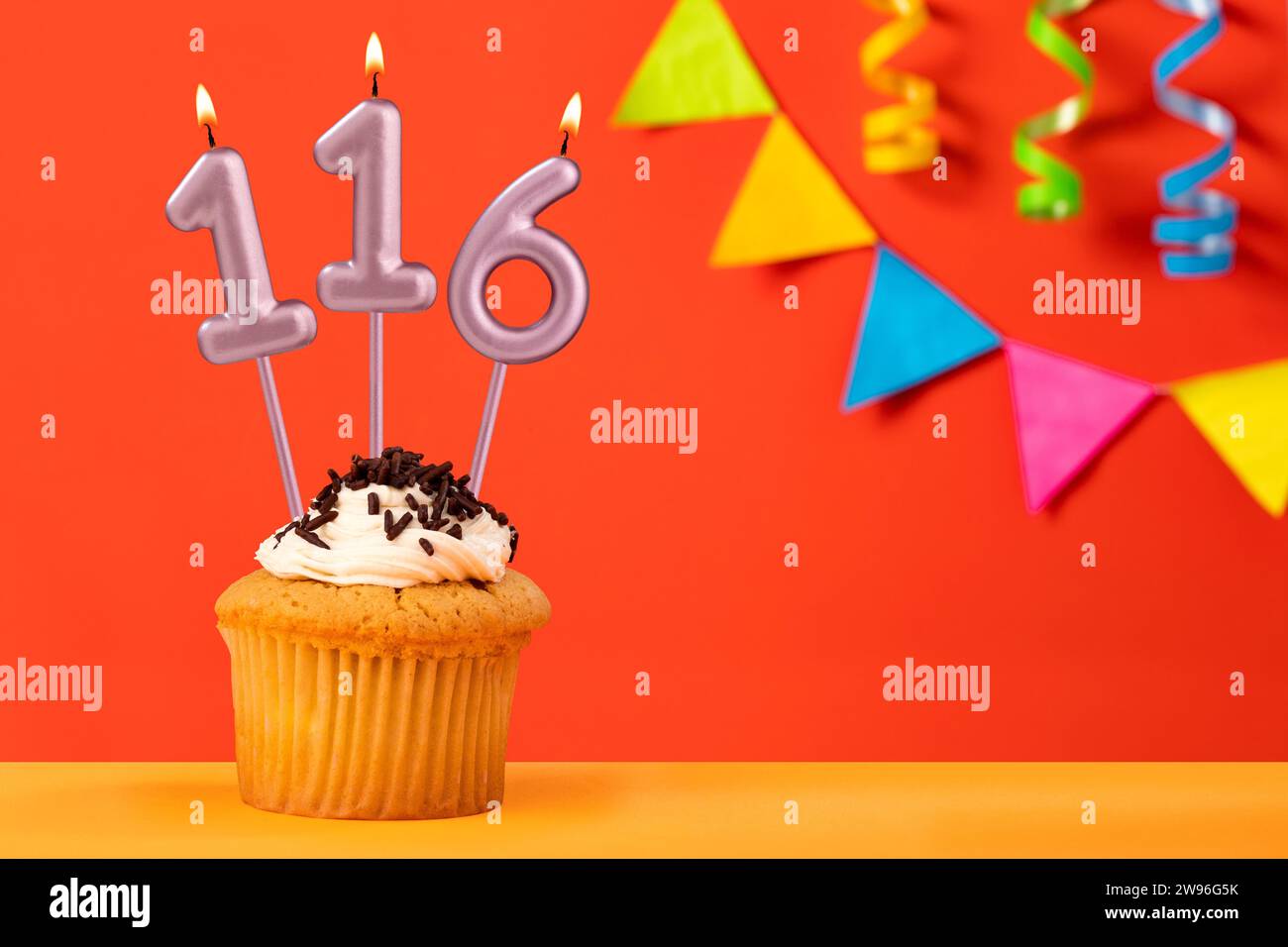 Birthday cake with number 116 candle - Sparkling orange background with ...
