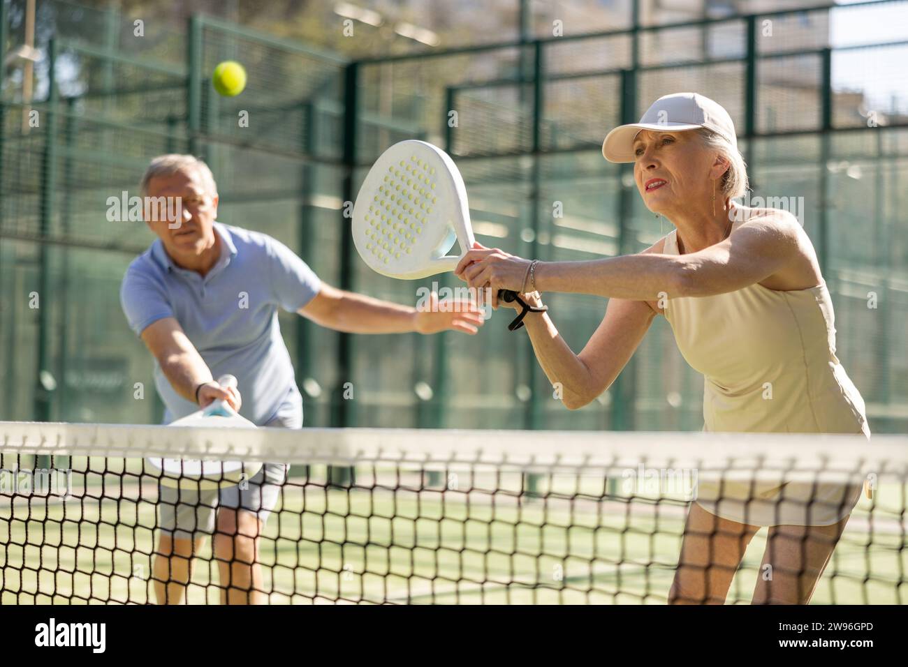 Sportive man woman playing tennis hi-res stock photography and images ...