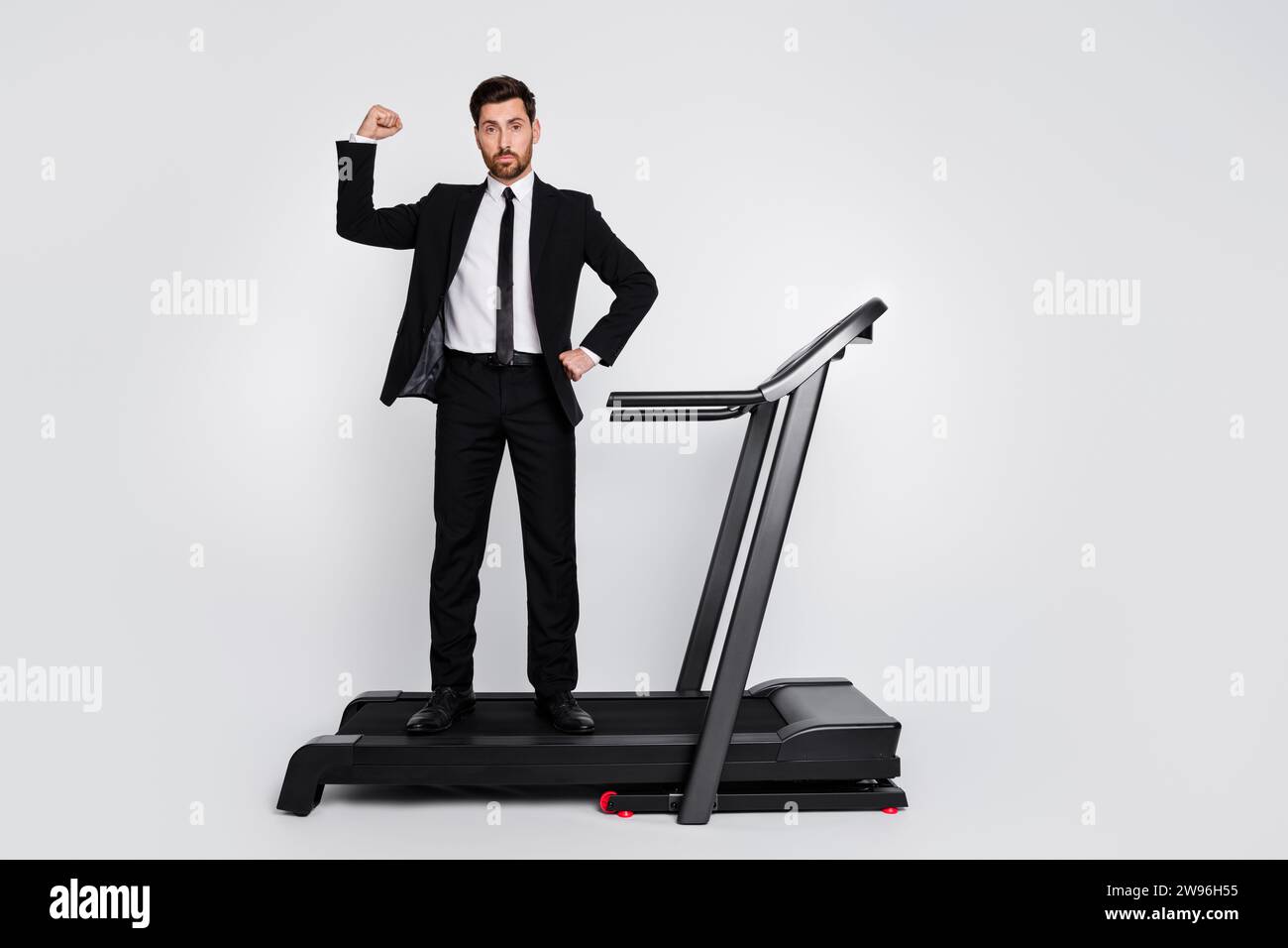 Full body photo of sportive classy person stand treadmill flexing ...
