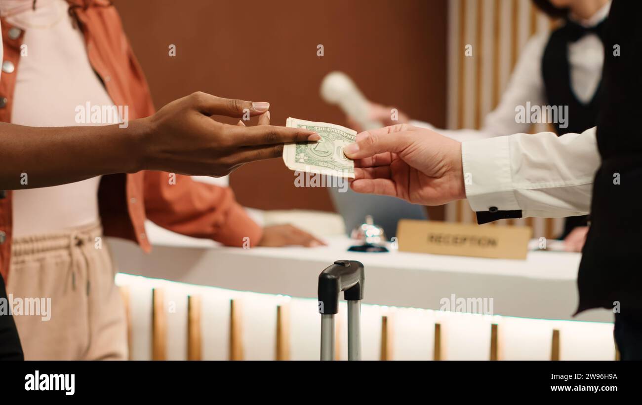 Friendly professional bellhop employee helping hi-res stock photography ...