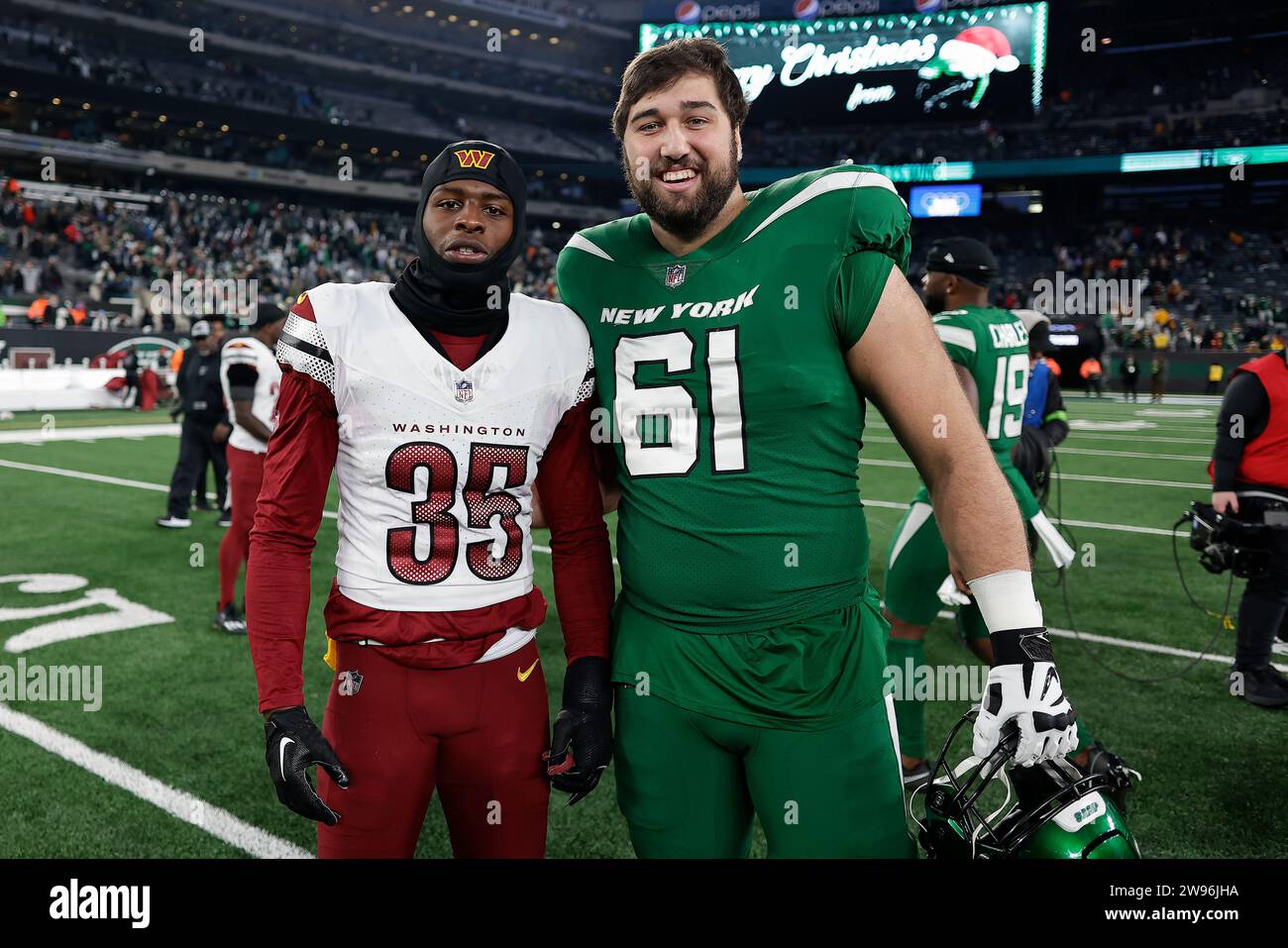 Washington Commanders safety Percy Butler (35) and New York Jets ...