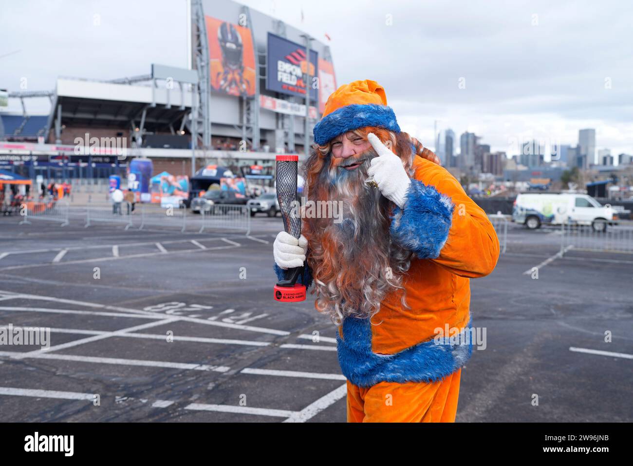 Dressed as Santa Claus, a Denver Broncos fan named Scott Hood is poses ...