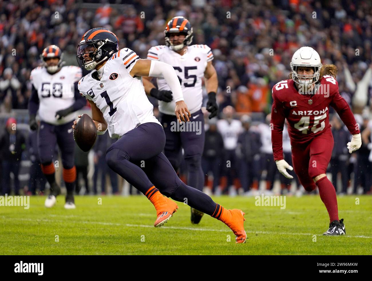 Chicago Bears quarterback Justin Fields heads too the end zone for a ...