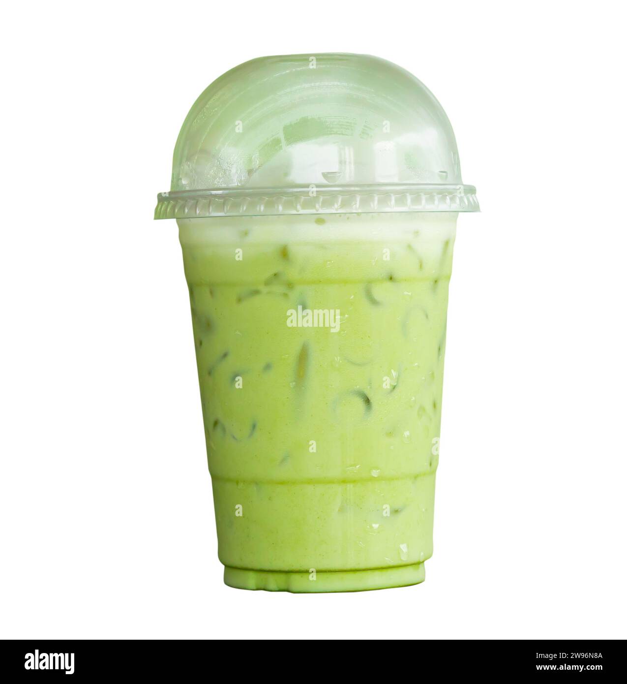 Iced matcha green tea with condensed milk in transparent plastic glass ...