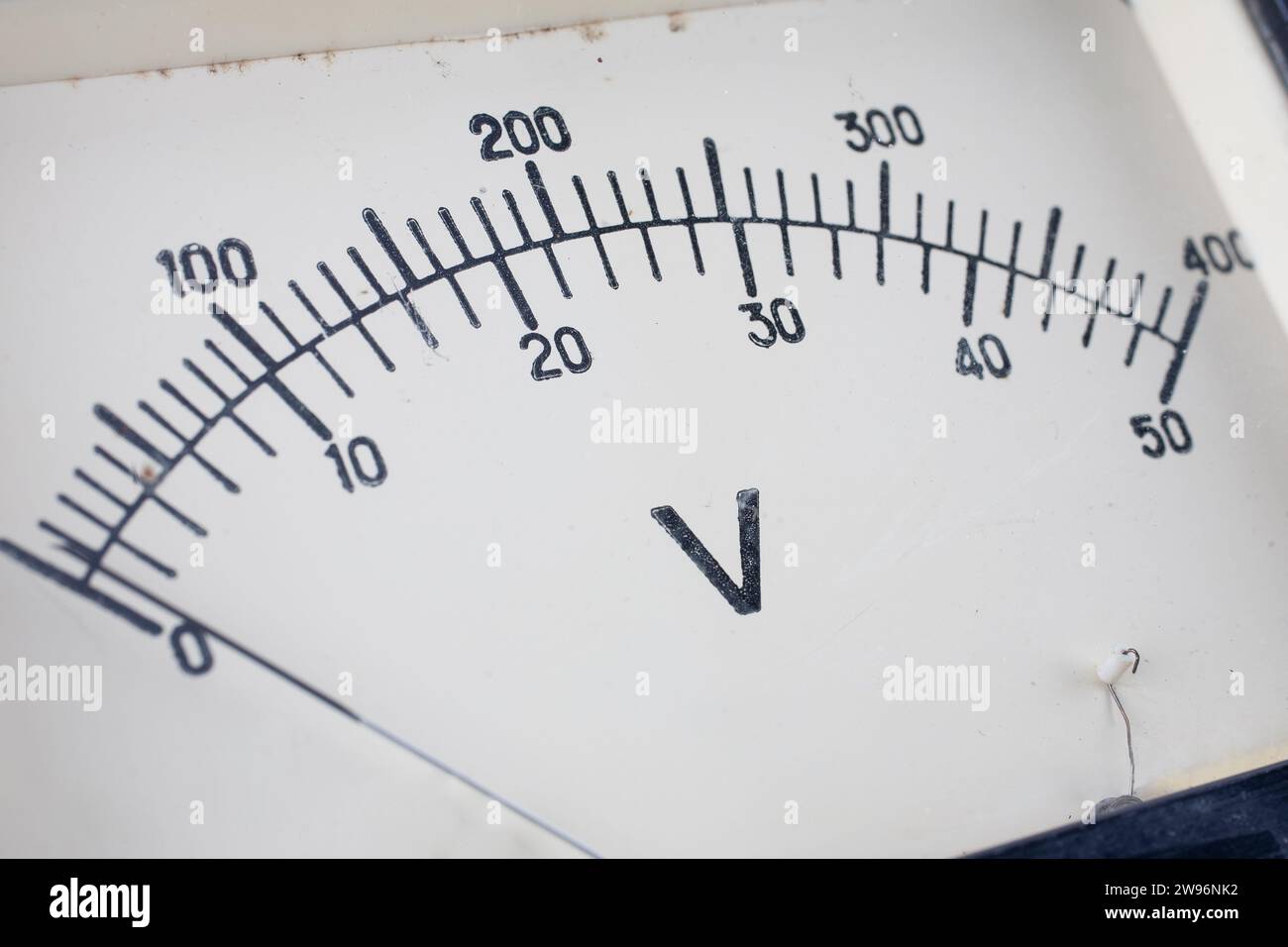 Close-up of an vintage ancient voltmeter isolated on white background ...